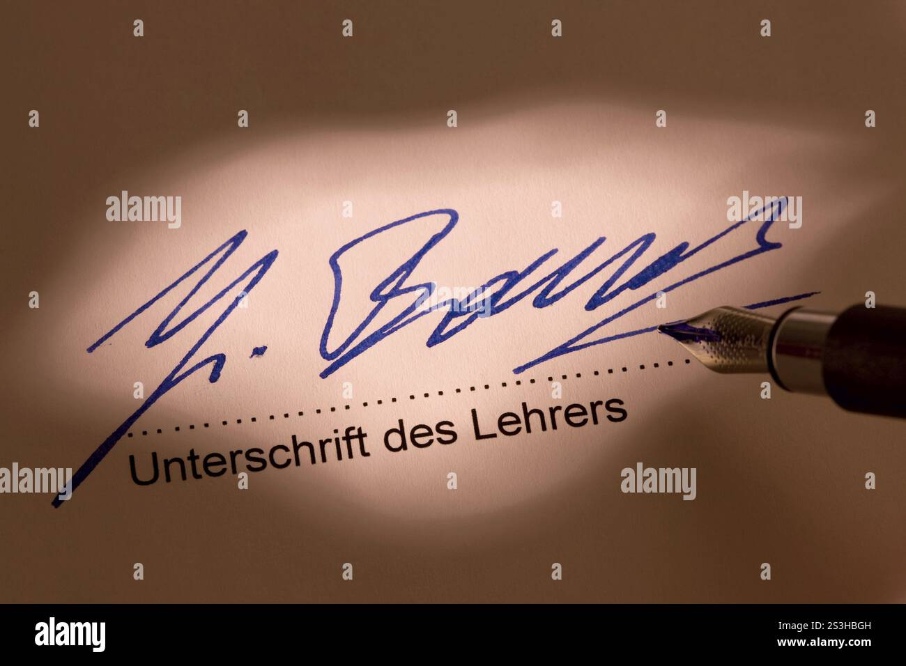 Handwritten signature under an official document of the school Stock ...