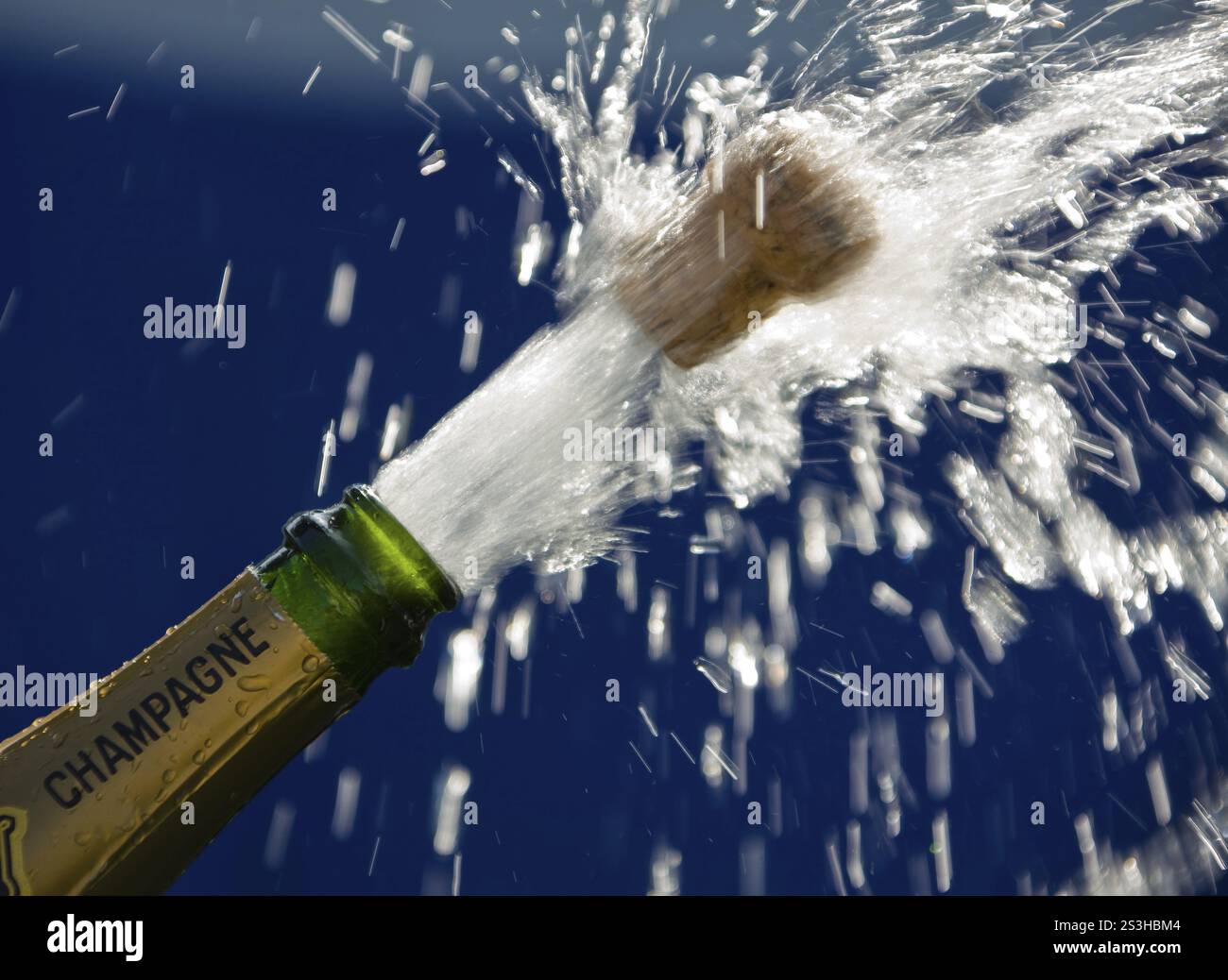 Popping cork of an opened champagne bottle Stock Photo - Alamy