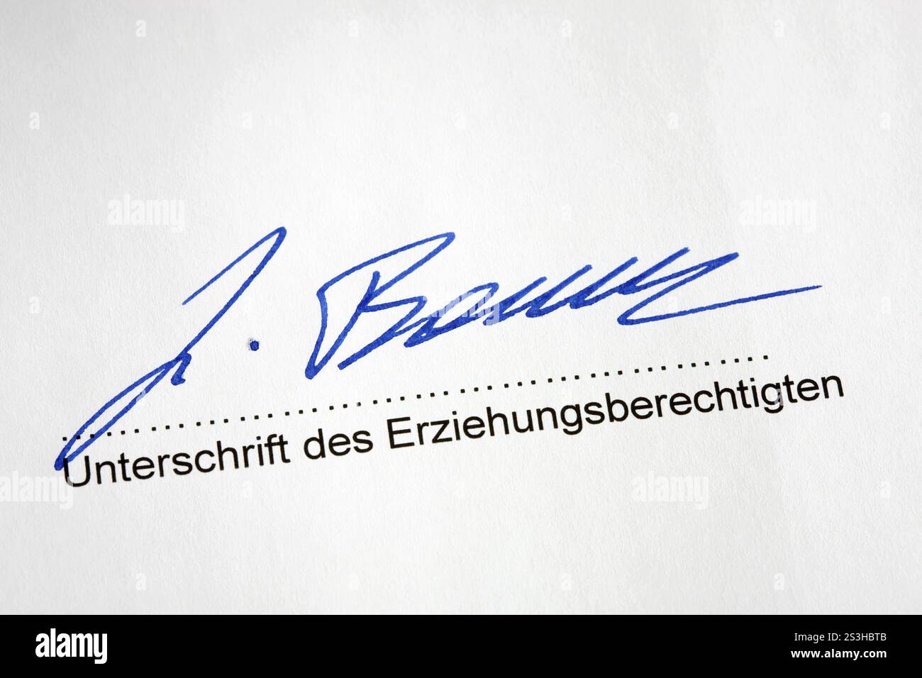 Handwritten signature under an official document of the school Stock ...