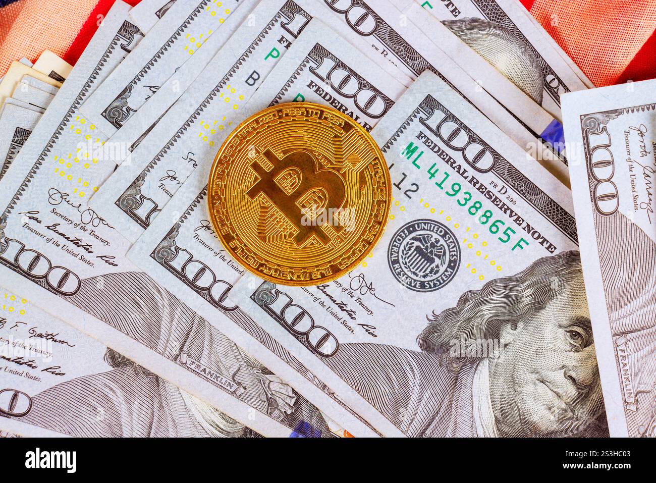 Blend of American hundred dollar bills golden Bitcoin shows link ...