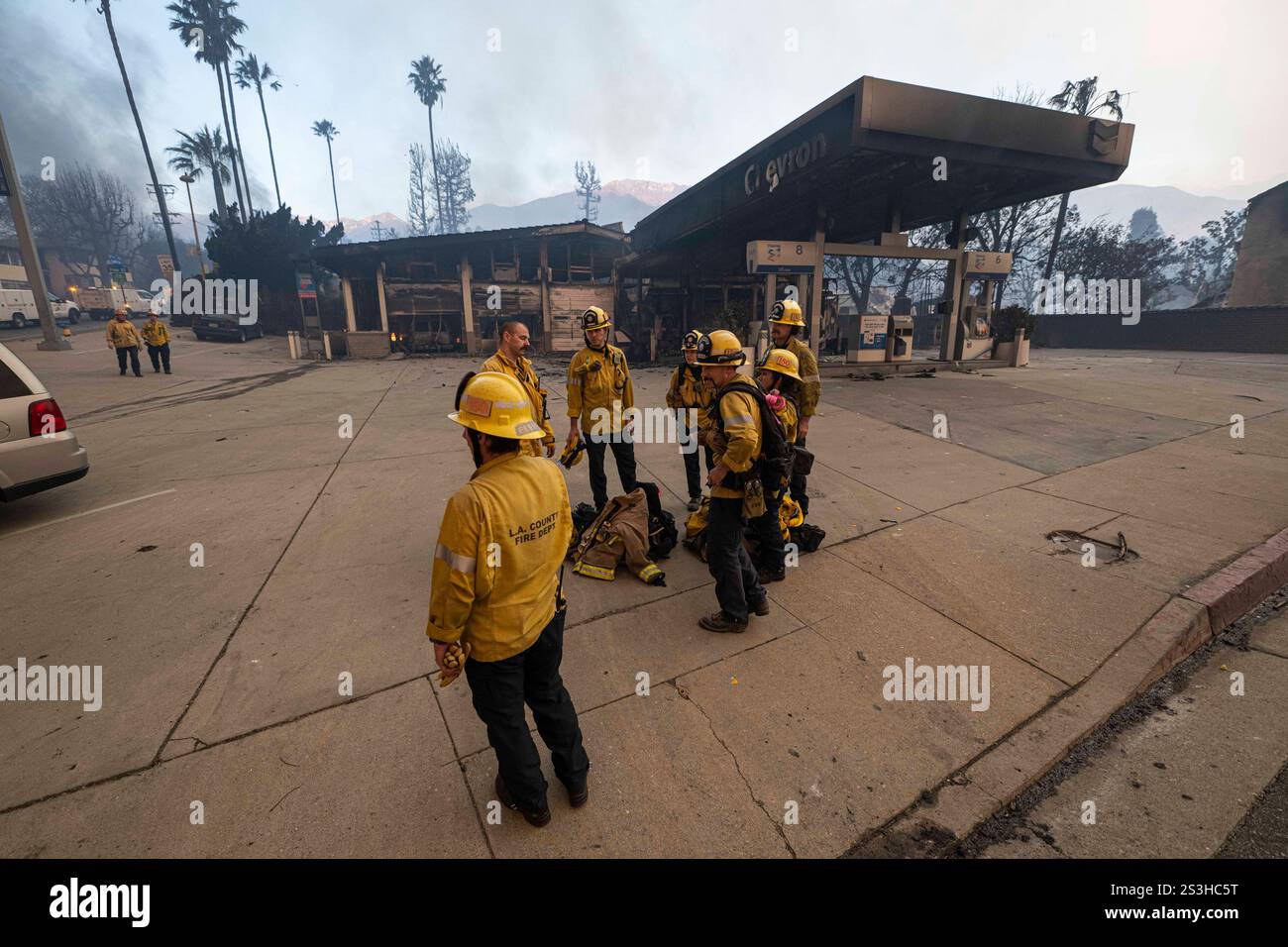 Altadena, United States. 08th Jan, 2025. LAFD Firefighters go over a ...