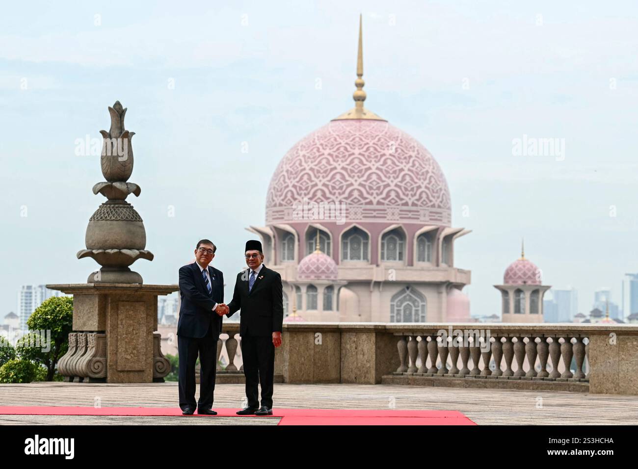 Malaysia's Prime Minister Anwar Ibrahim, right, and Japan's Prime ...