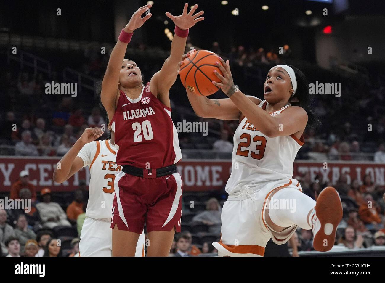 Texas forward Aaliyah Moore (23) grabs a rebound in front of Alabama guard Diana Collins (20 ...