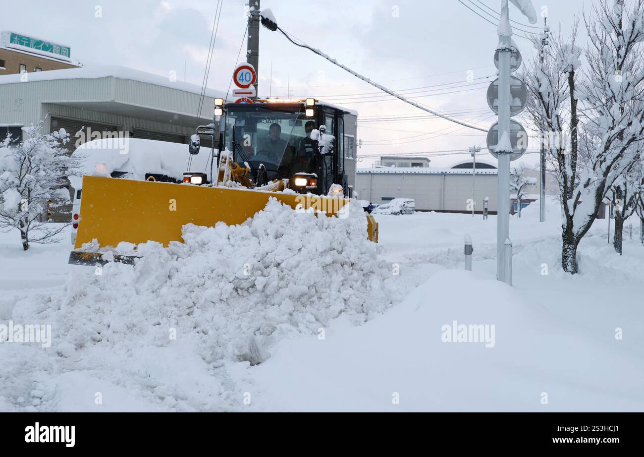 A snowplow removes snow in Tsuruoka in the northeastern Japan ...