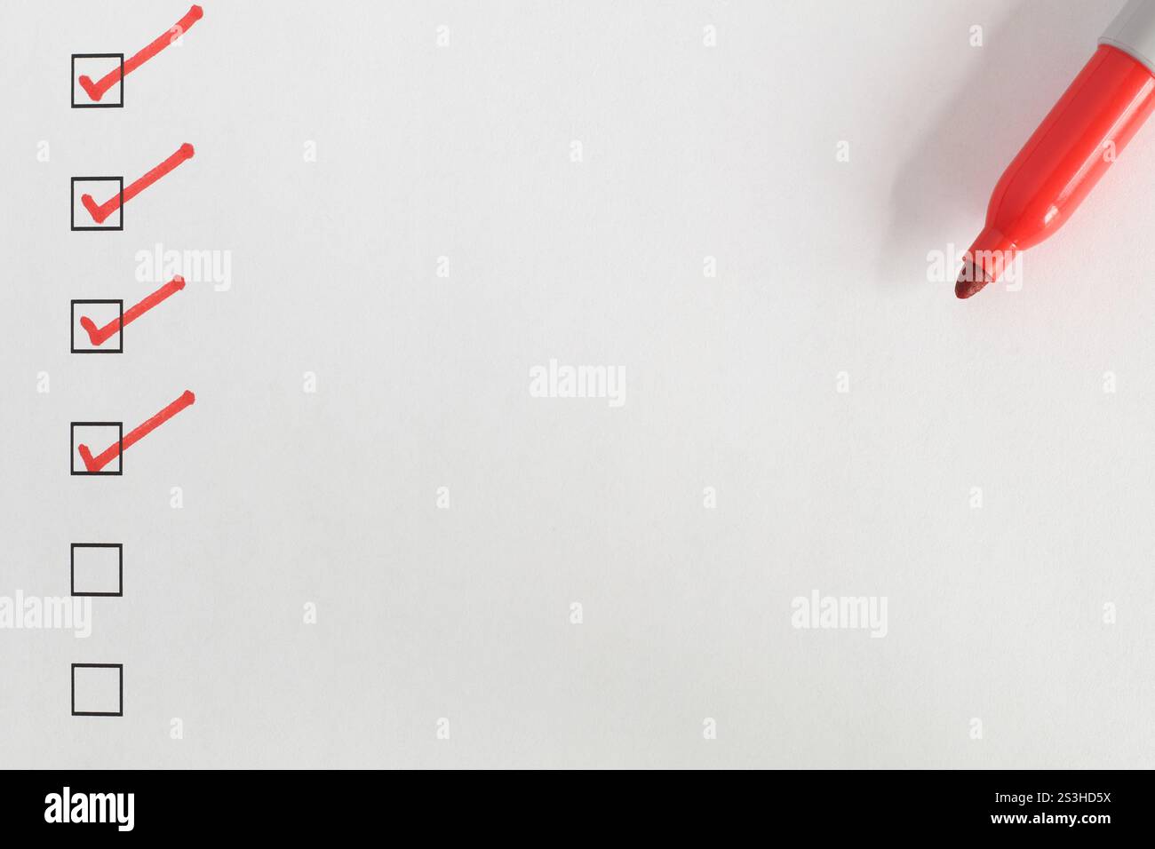 Checklist boxes close up with red ticks and marker Stock Photo - Alamy