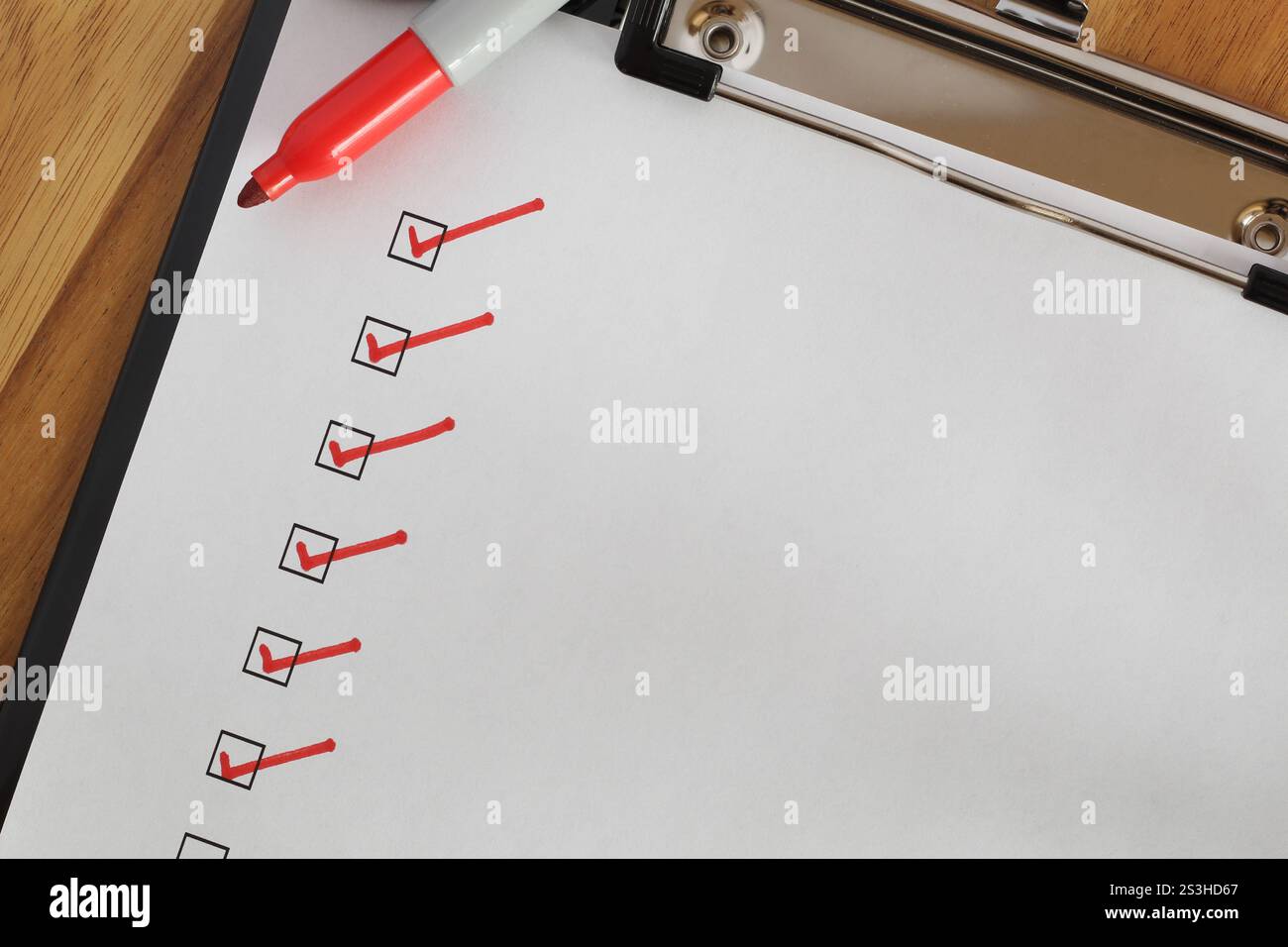 Checklist boxes close up with red ticks and marker Stock Photo - Alamy
