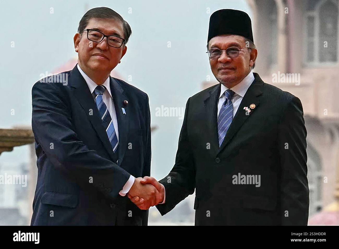 Malaysia's Prime Minister Anwar Ibrahim, right, and Japan's Prime ...