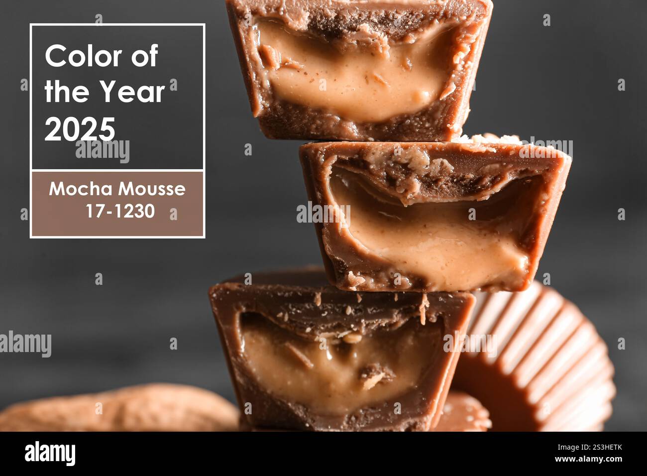 Tasty chocolate candies with peanut butter on grey background, closeup ...