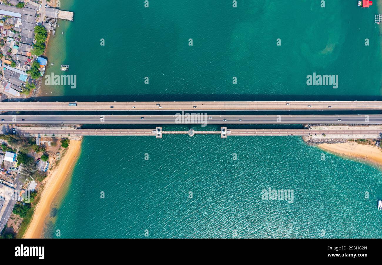 Aerial view of the bridge is across the blue ocean waters of the ...