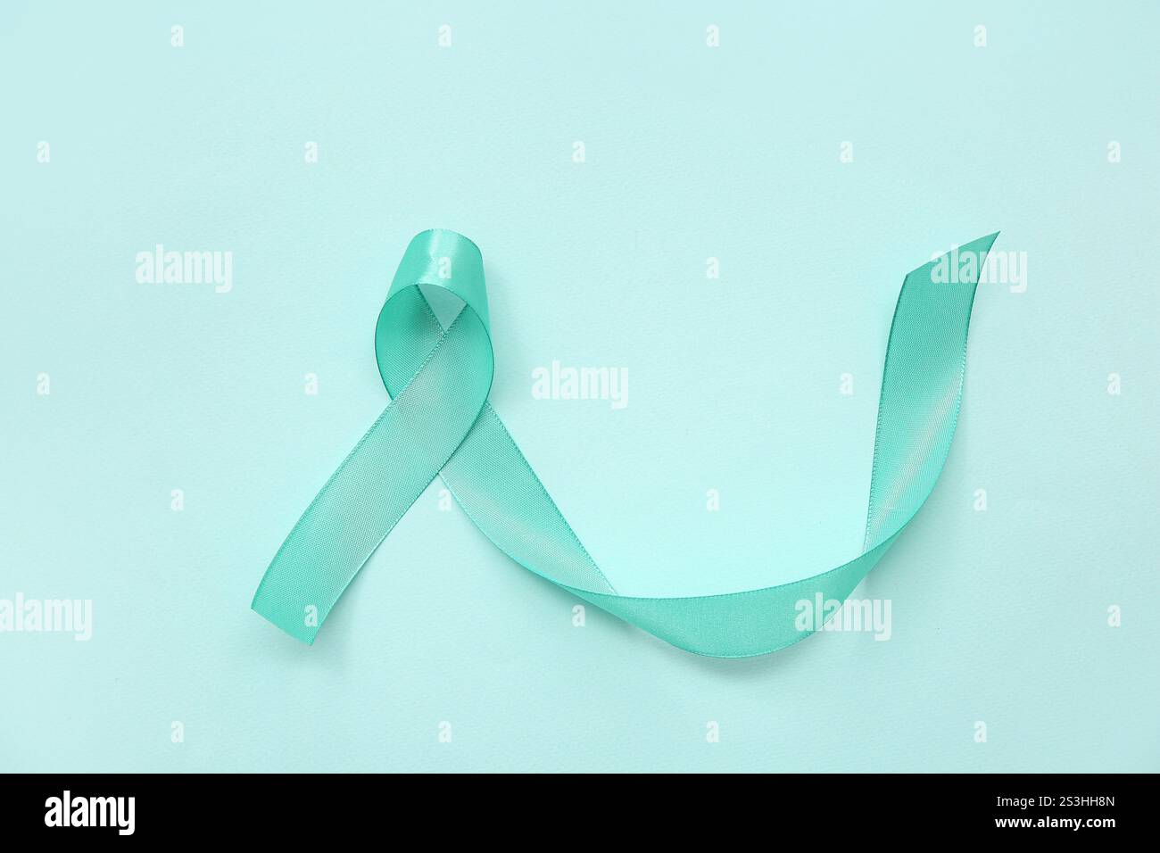 Turquoise ribbon on color background. Cervical Health Awareness Month ...