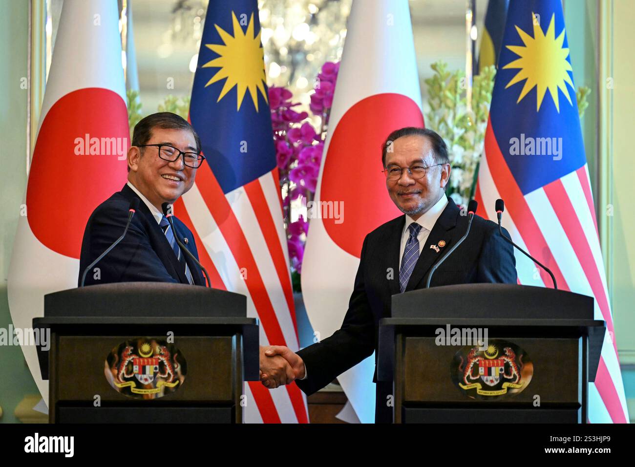 Malaysia's Prime Minister Anwar Ibrahim, right, and Japan's Prime ...