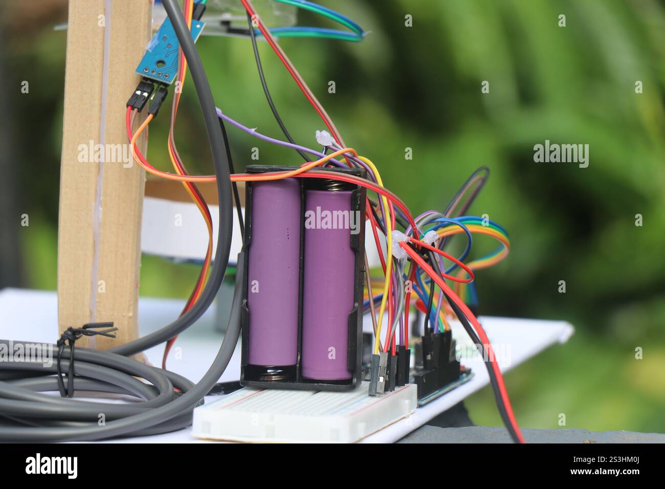 Many jumper wires are connected to breadboard and controller along with ...