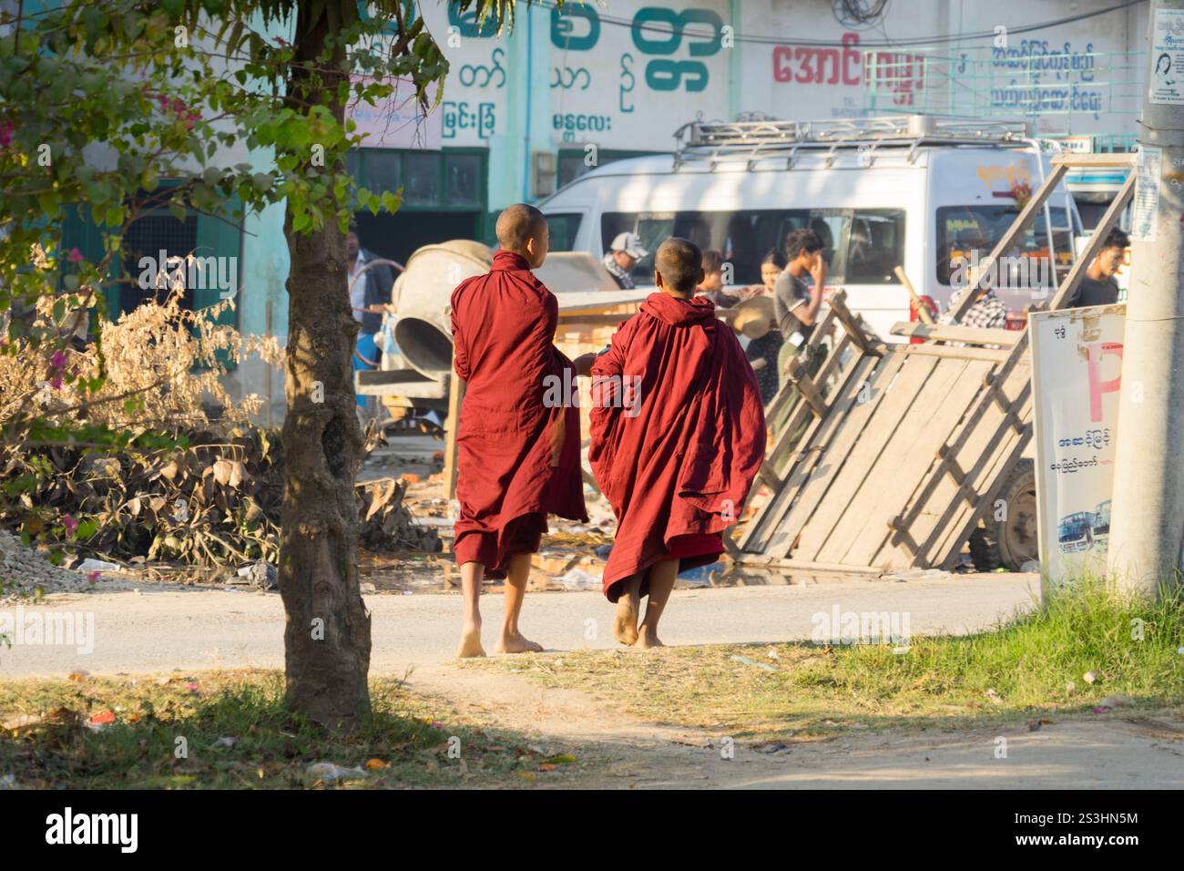 Two Buddhist Monks Walking Through a Busy Street in Myanmar Stock Photo ...