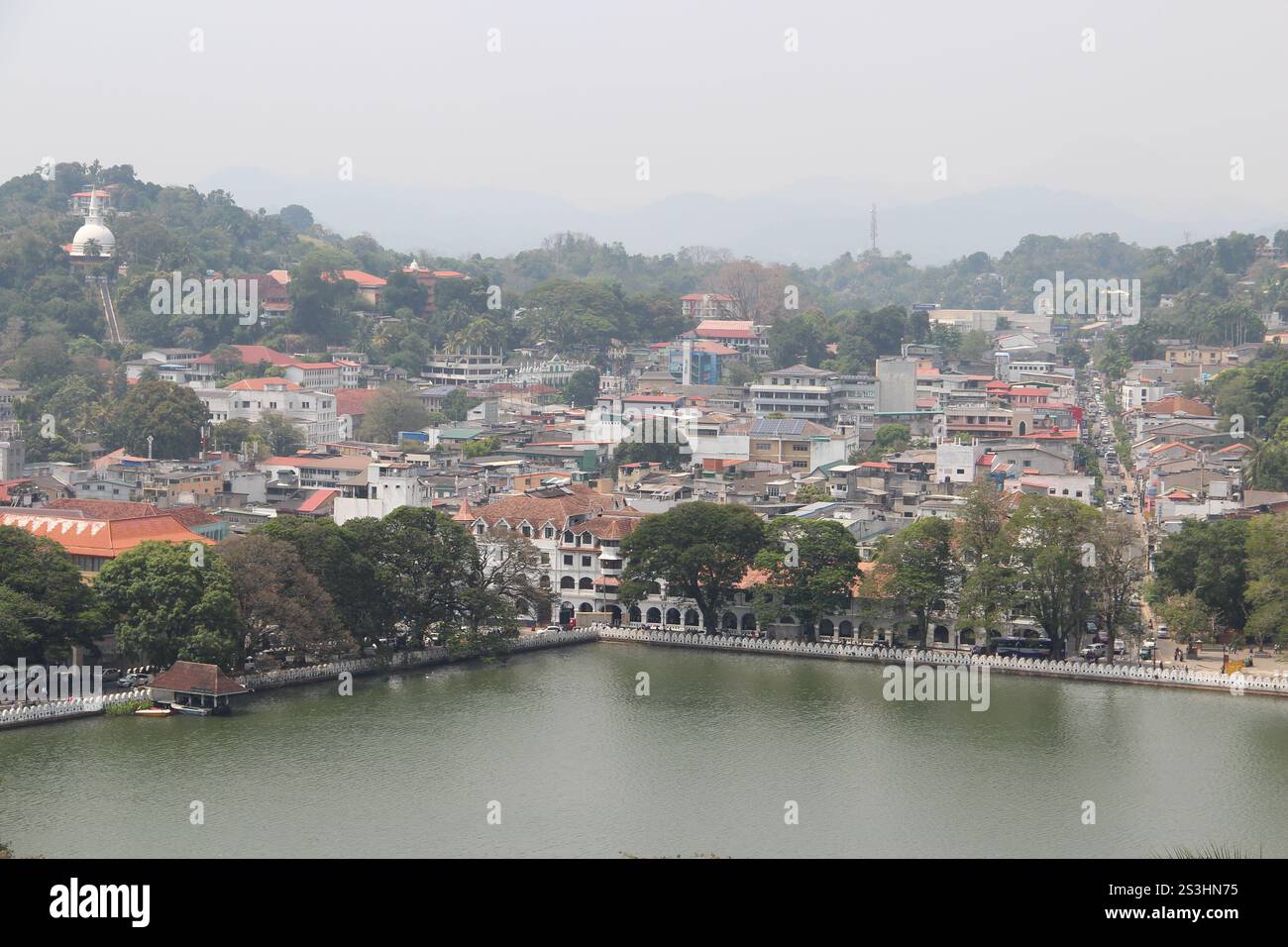 Scenic view of Kandy town nestled amidst lush mountains, Sri Lanka ...