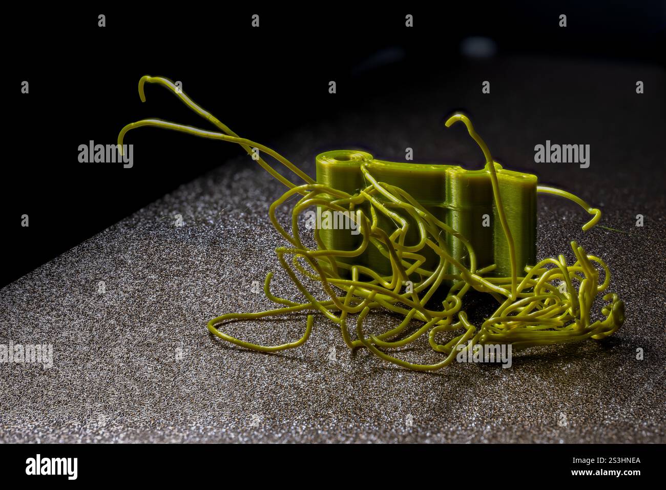 spaghetti failure on a 3D printer caused by high temperatures turning filament into a fluid ...