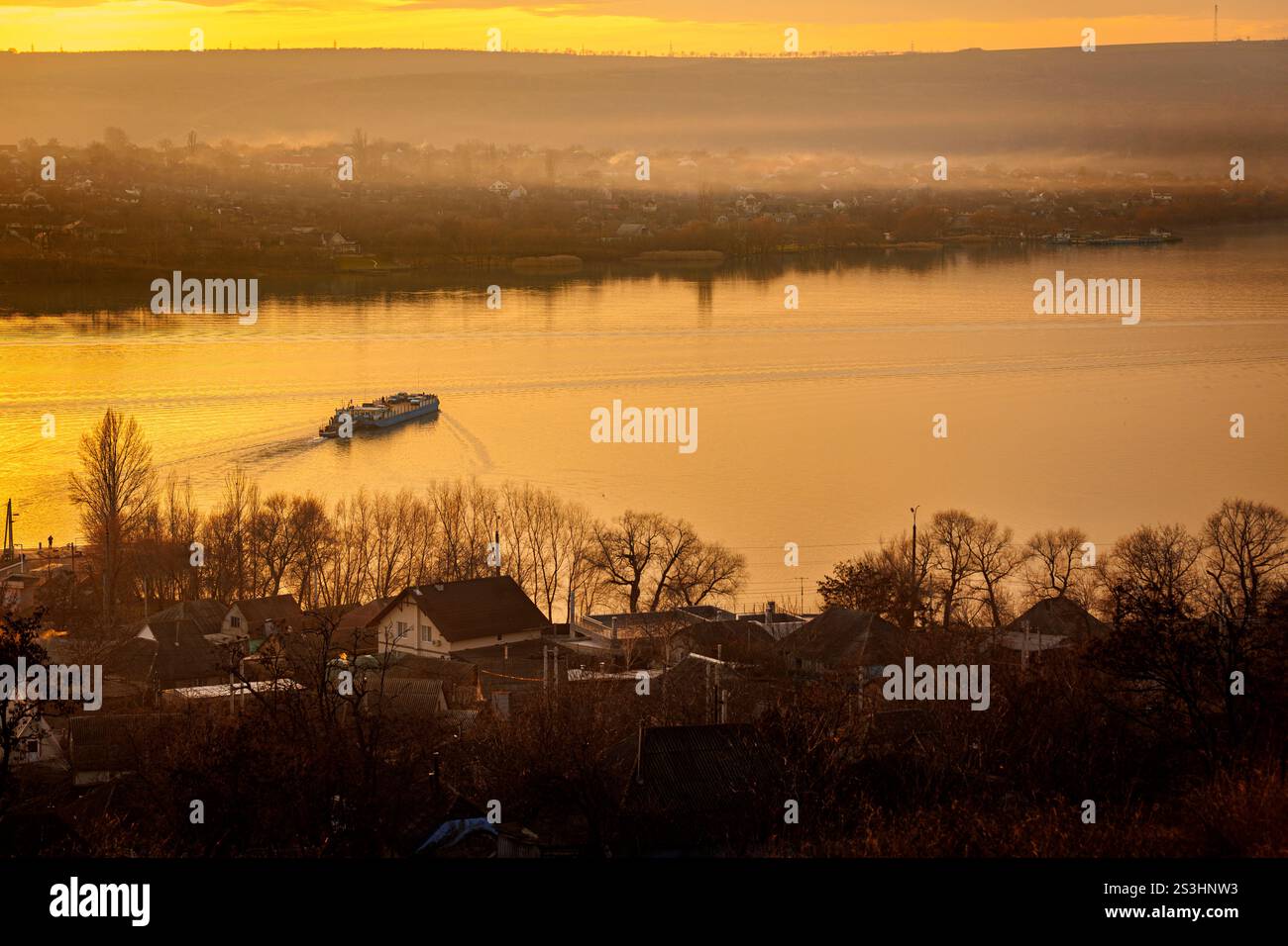 A ferry sails to the left bank of the Dniester river, the border ...