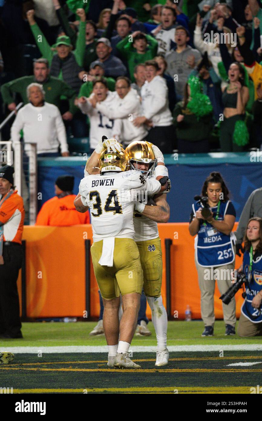 Notre Dame linebacker Drayk Bowen (34) hugs linebacker Jack Kiser (24 ...