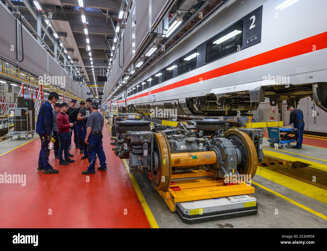 Cottbus, Germany. 09th Jan, 2025. Workers assemble a wheelset at ...