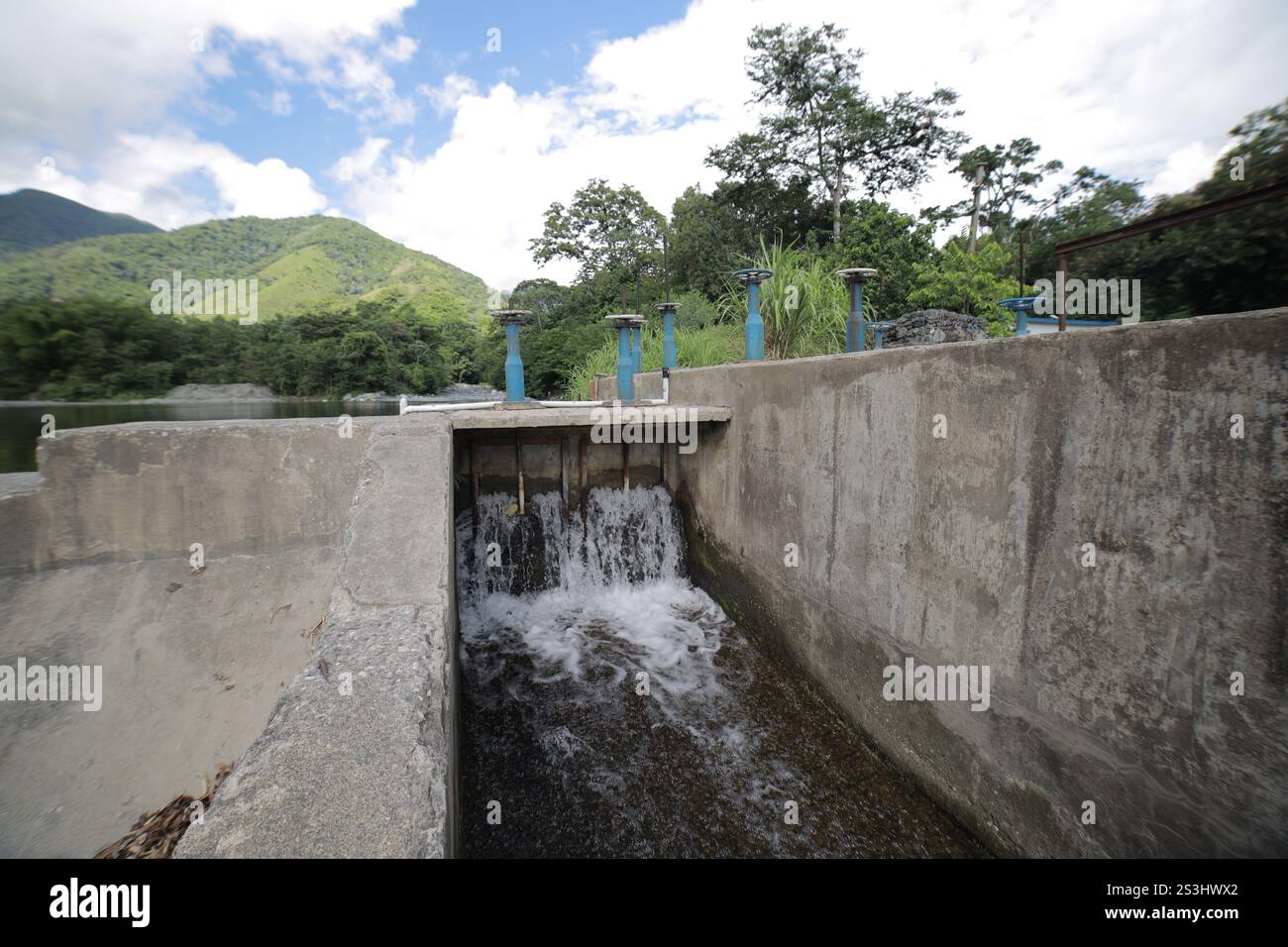 Front water outlet at the hydroelectric dam, beautiful sunny day Stock ...