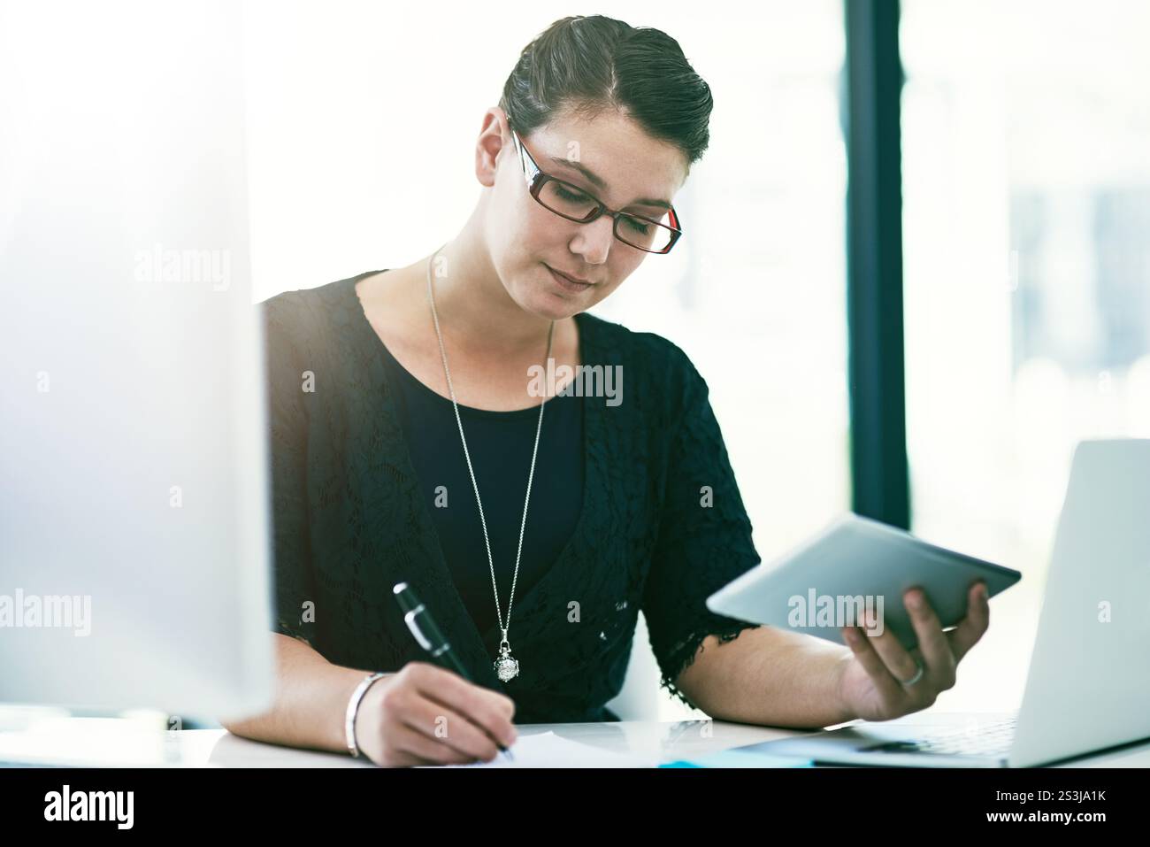 Writing, serious and woman with tablet, office and paralegal with ...