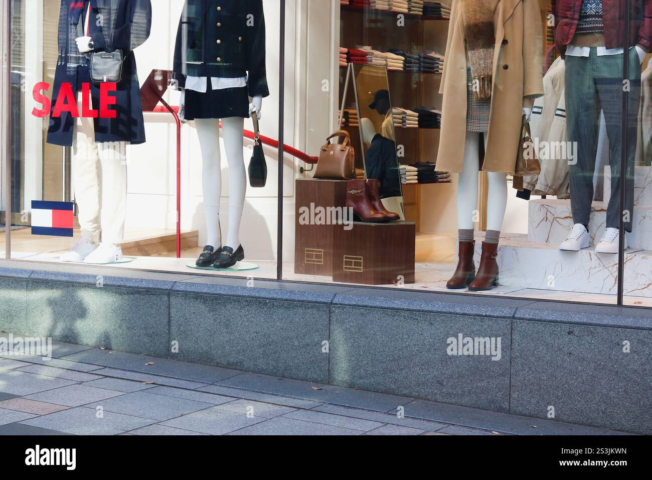TOKYO, JAPAN - January 8, 2025: Display in the window of a Tommy ...