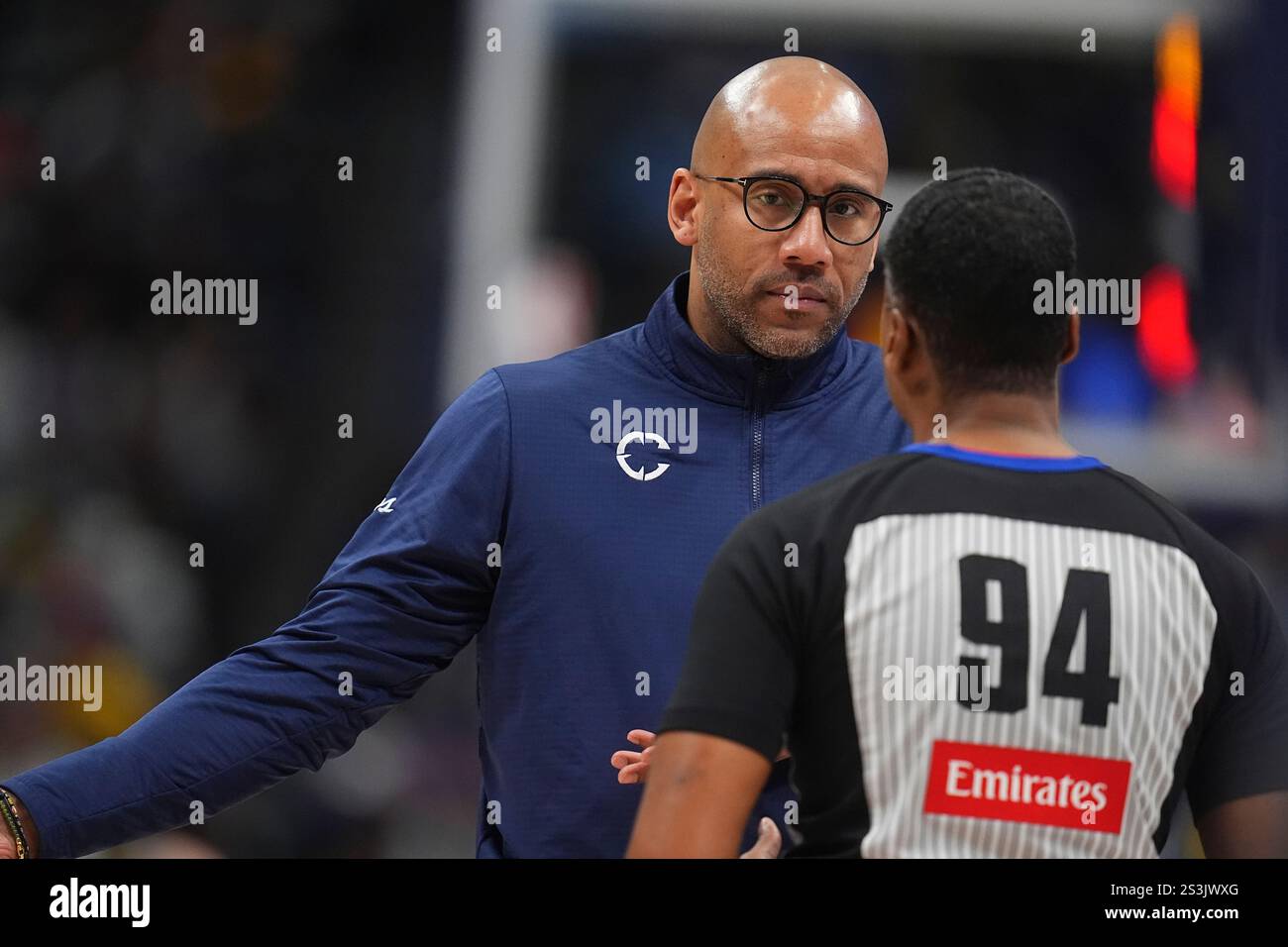 Los Angeles Clippers assistant coach Dahntay Jones confers with referee ...