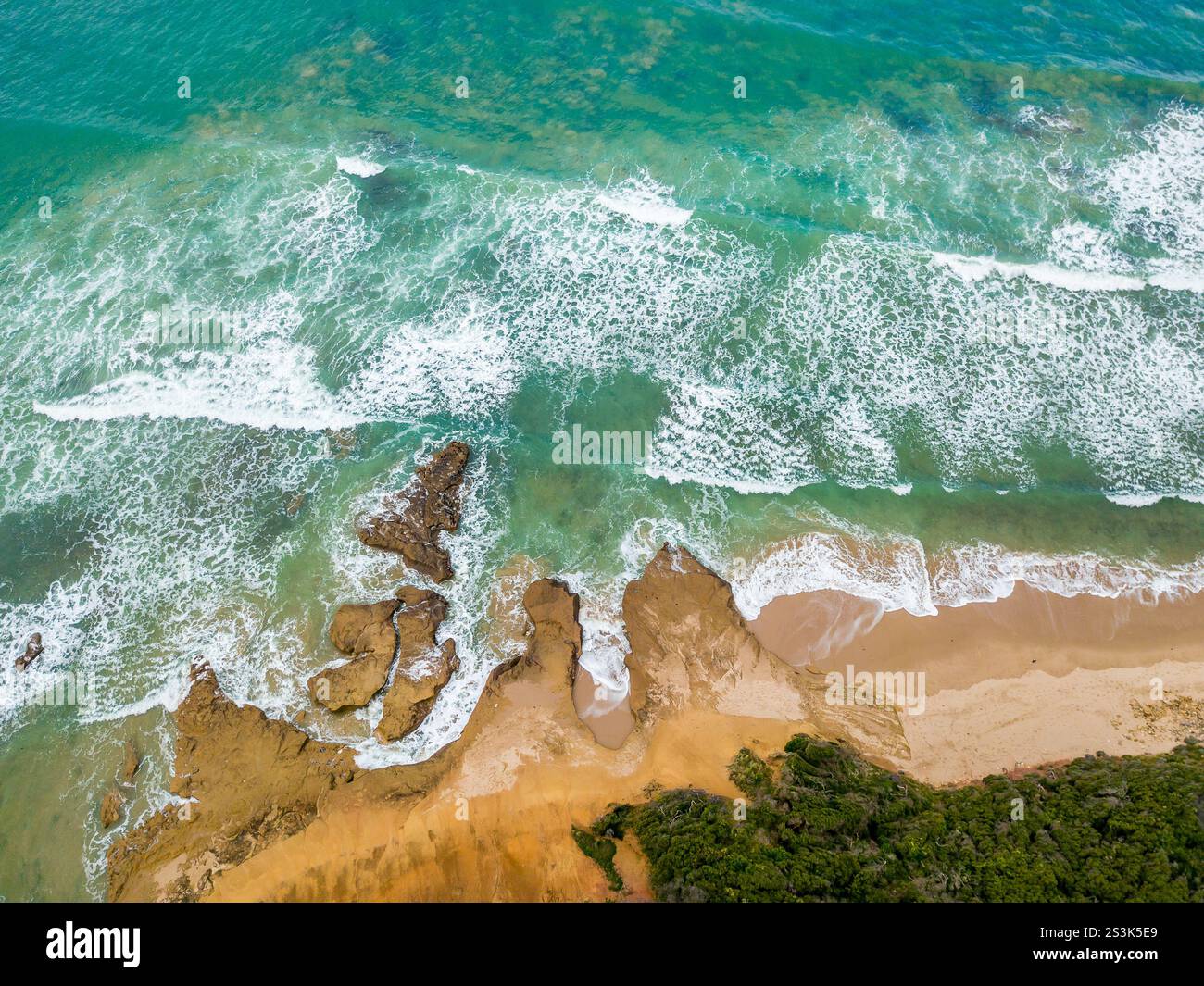 Aerial view of waves breaking on rocky ledges at Aireys Inlet on the ...