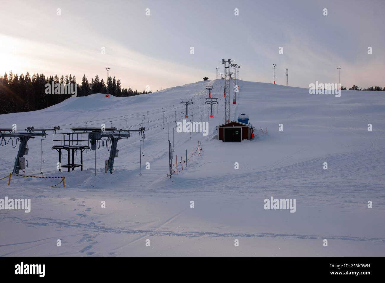 Ski lift, the complex before opening for the day. Prepared slope, and ...