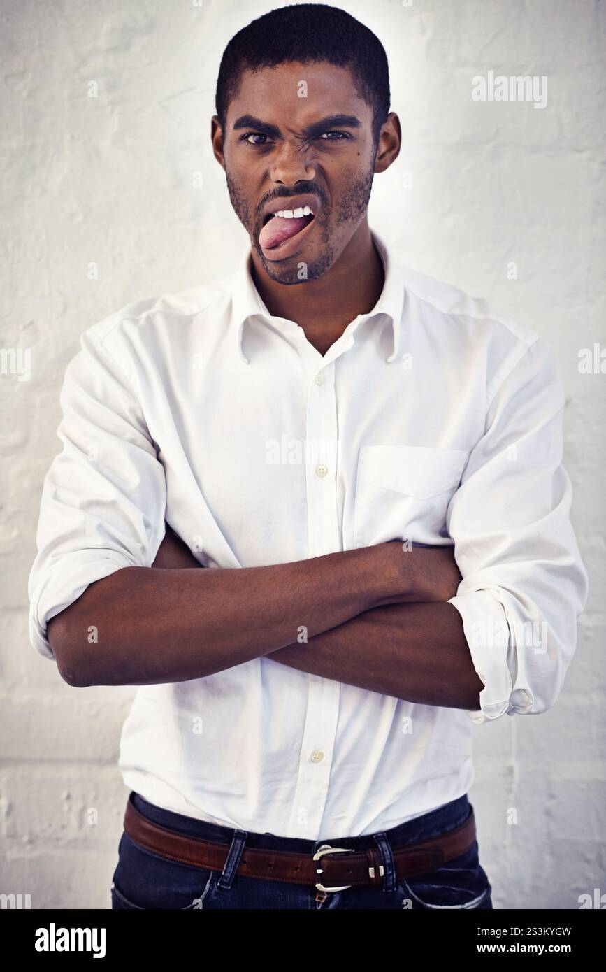 Comic, crazy and black man with arms crossed, funny face and portrait ...