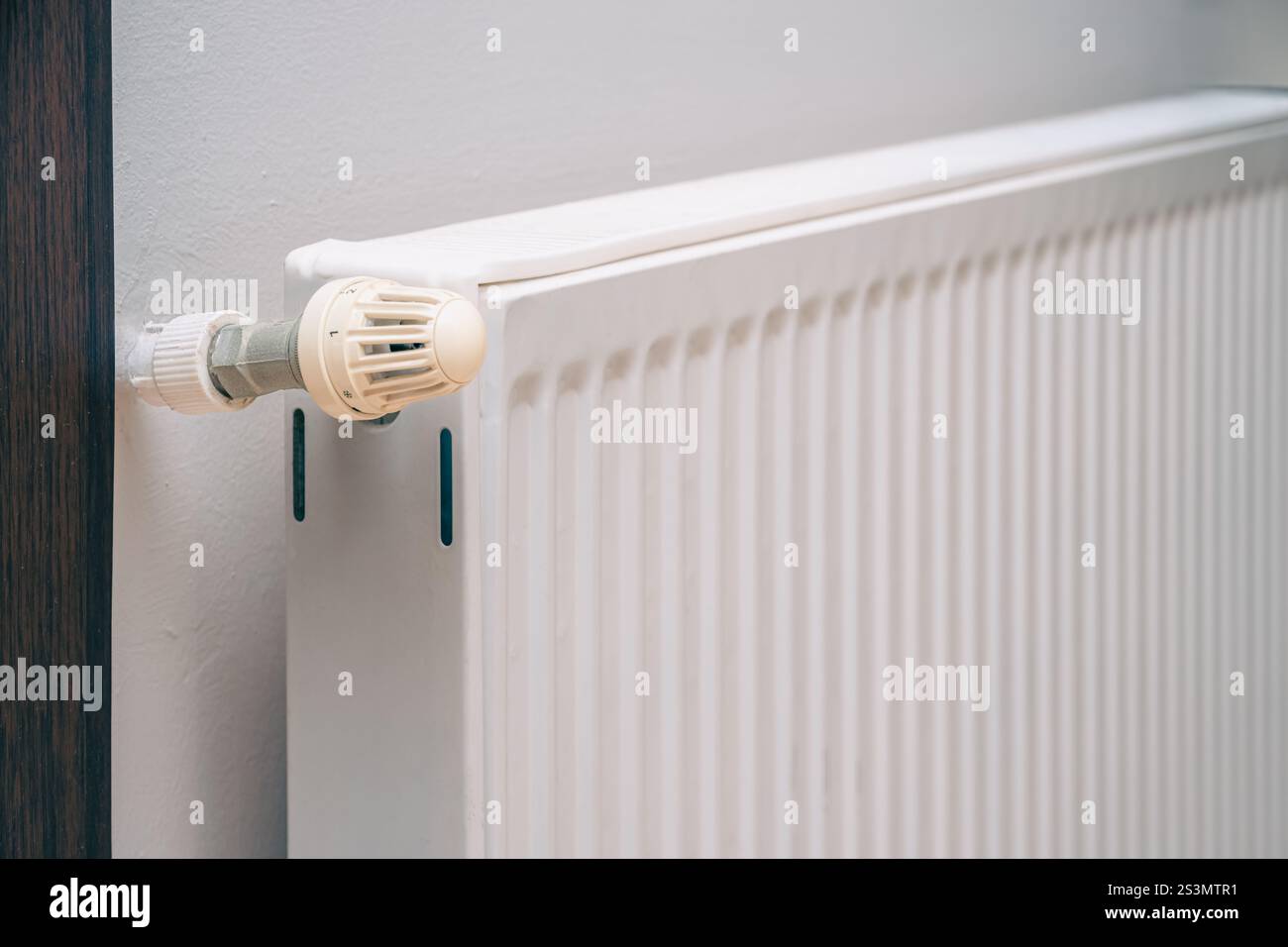 Temperature knob of the heating radiator in the hallway of the house ...