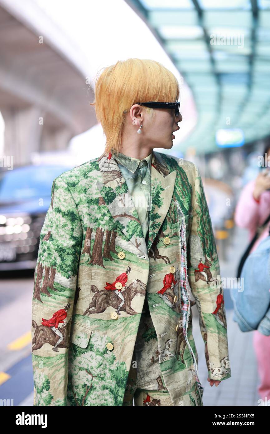 Chinese rapper, singer, songwriter and dancer Zhou Zhennan appears at the airport in Macao ...