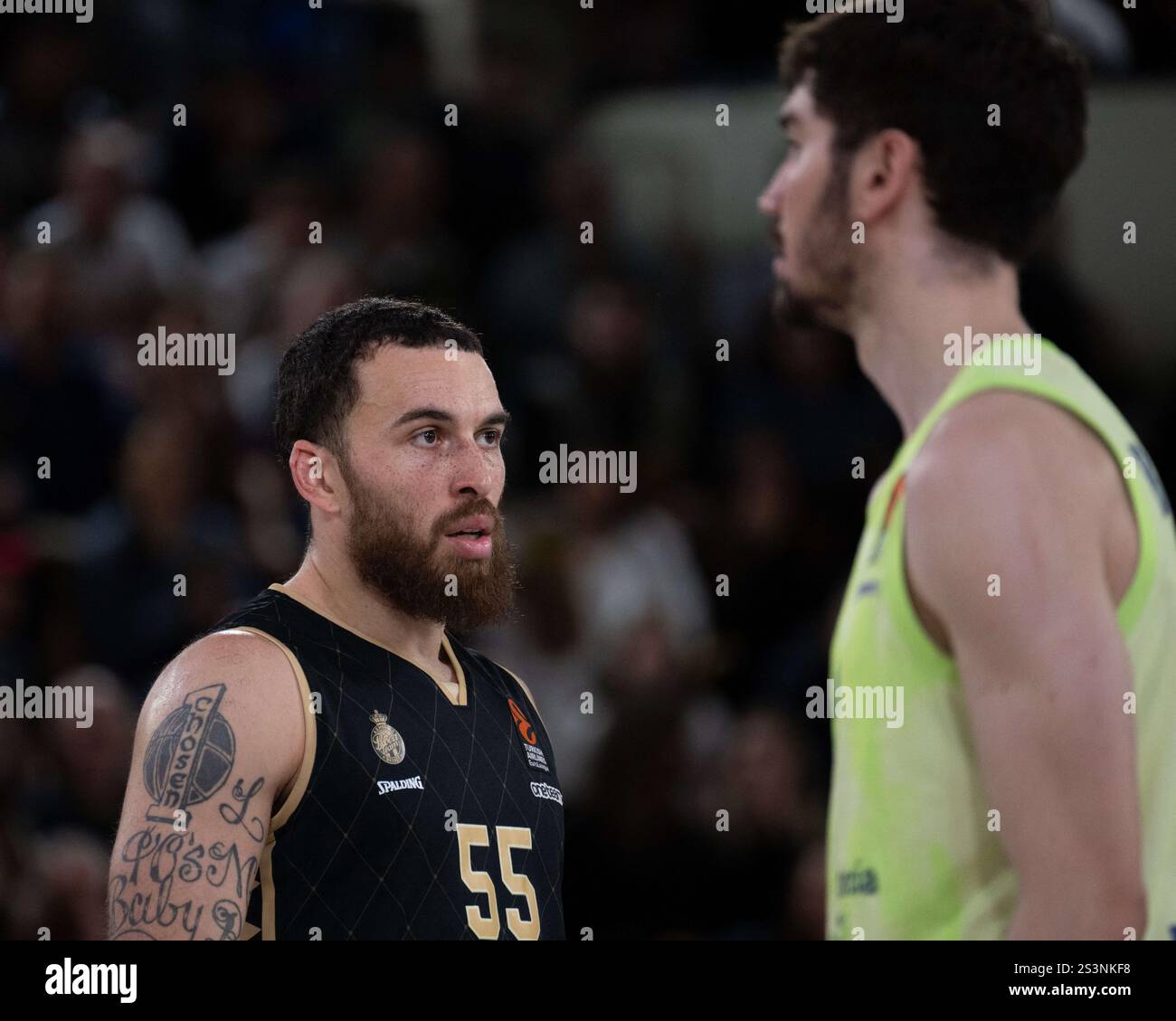 Monaco player #55 Mike James and Barcelona player #8 Dario Brizuela are ...