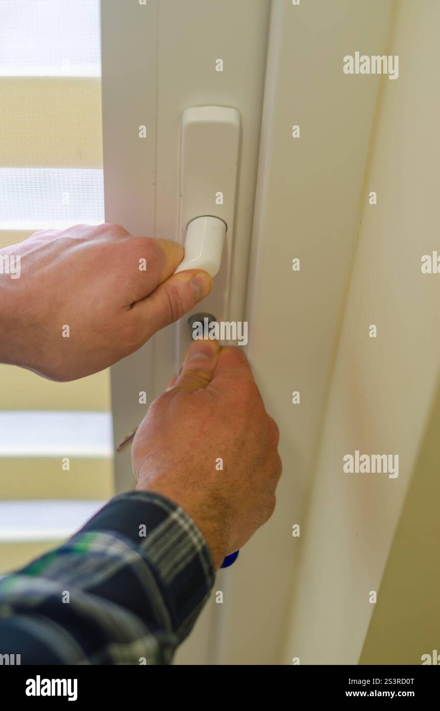 male hands unlocking locking the door with keys . High quality photo ...