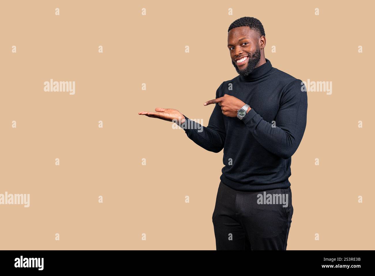 Cheerful businessman pointing at his open hand presenting something on ...