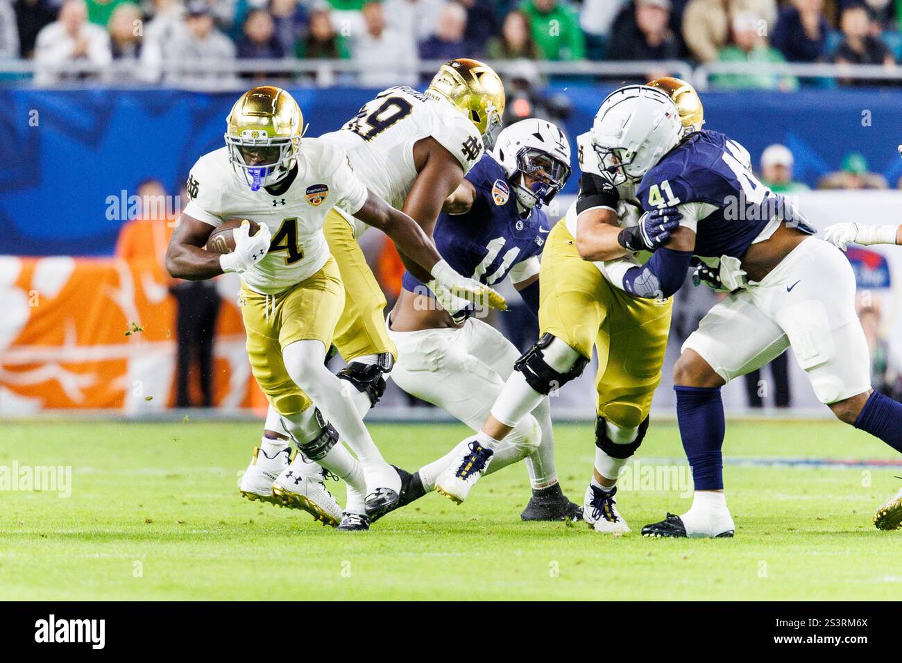 Miami Gardens, Florida, USA. 09th Jan, 2025. Notre Dame running back Jeremiyah Love (4) runs ...