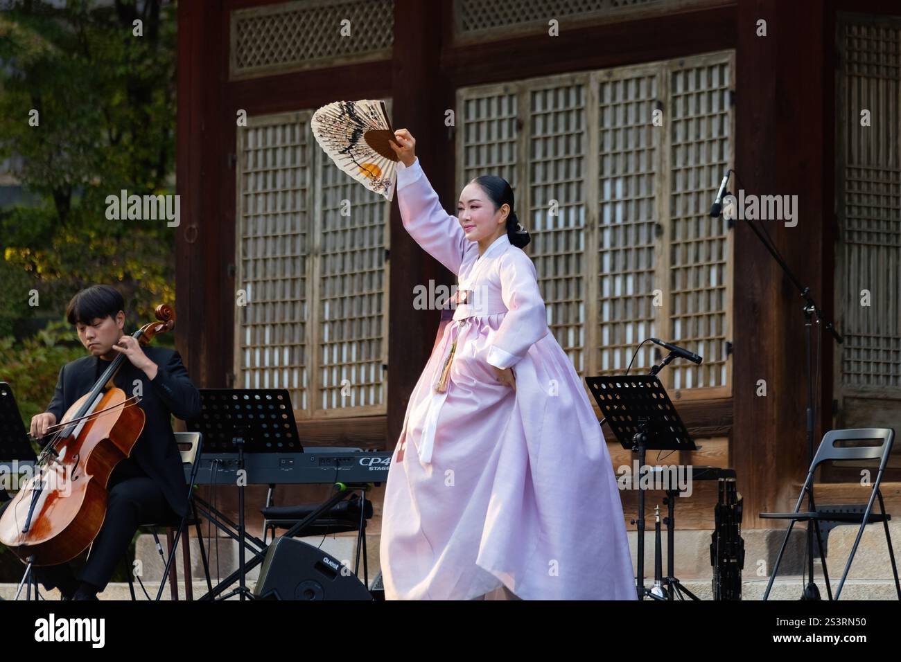 Korean woman dancer wearing traditional Korean clothing hanbok and a ...