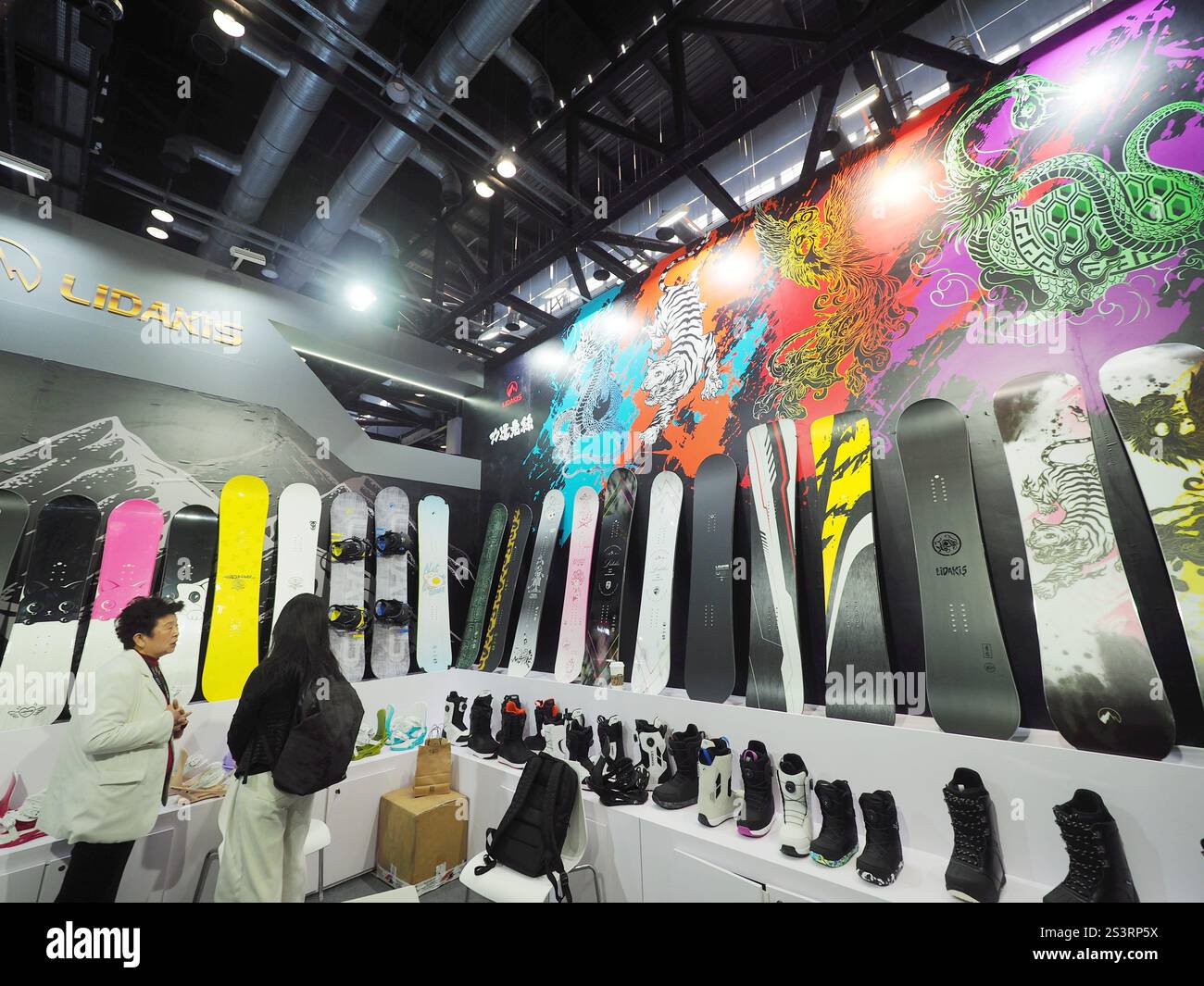 Visitors shop at the 2025 Asia Sportswear and Fashion Show at the China ...