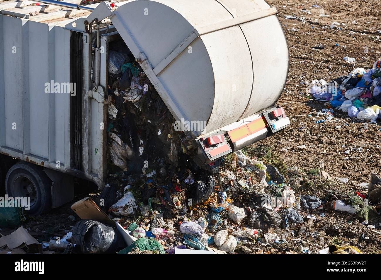 Truck unloading garbage on an open air dump. Waste recycling Stock ...
