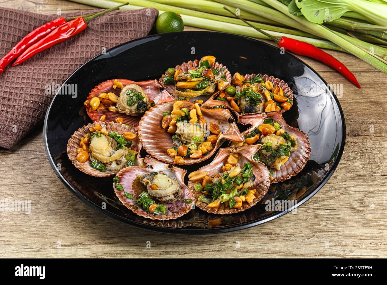 Baked scallops with scalion oil and green onion Stock Photo - Alamy