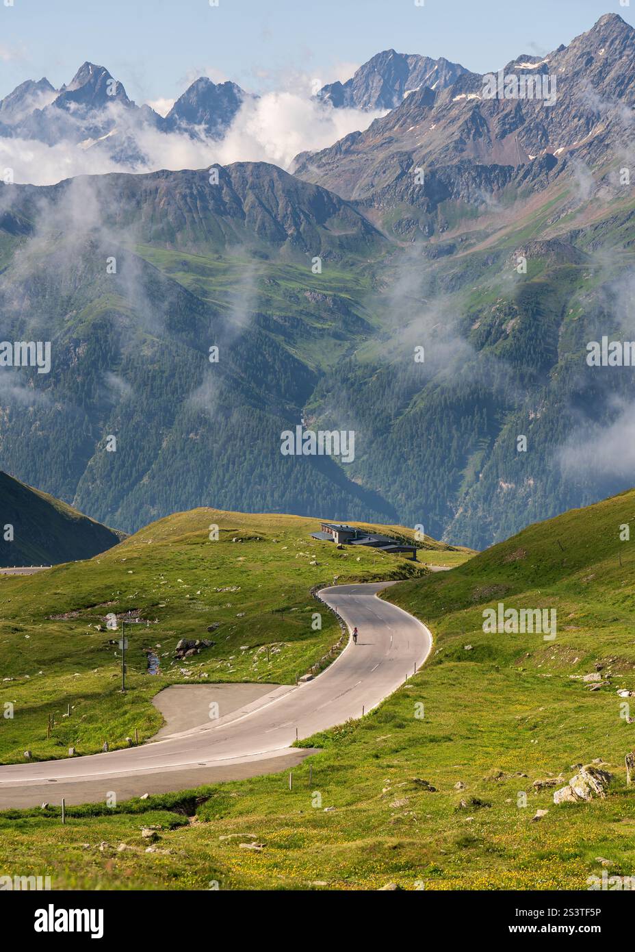 Girl- cyclist rides up famous Grossglockner Hochalpenstrasse high ...