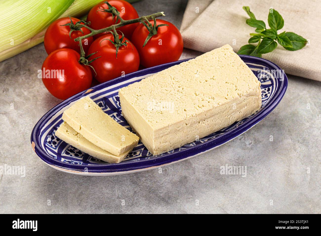 Soya vegan tofu cheese brick over board Stock Photo - Alamy