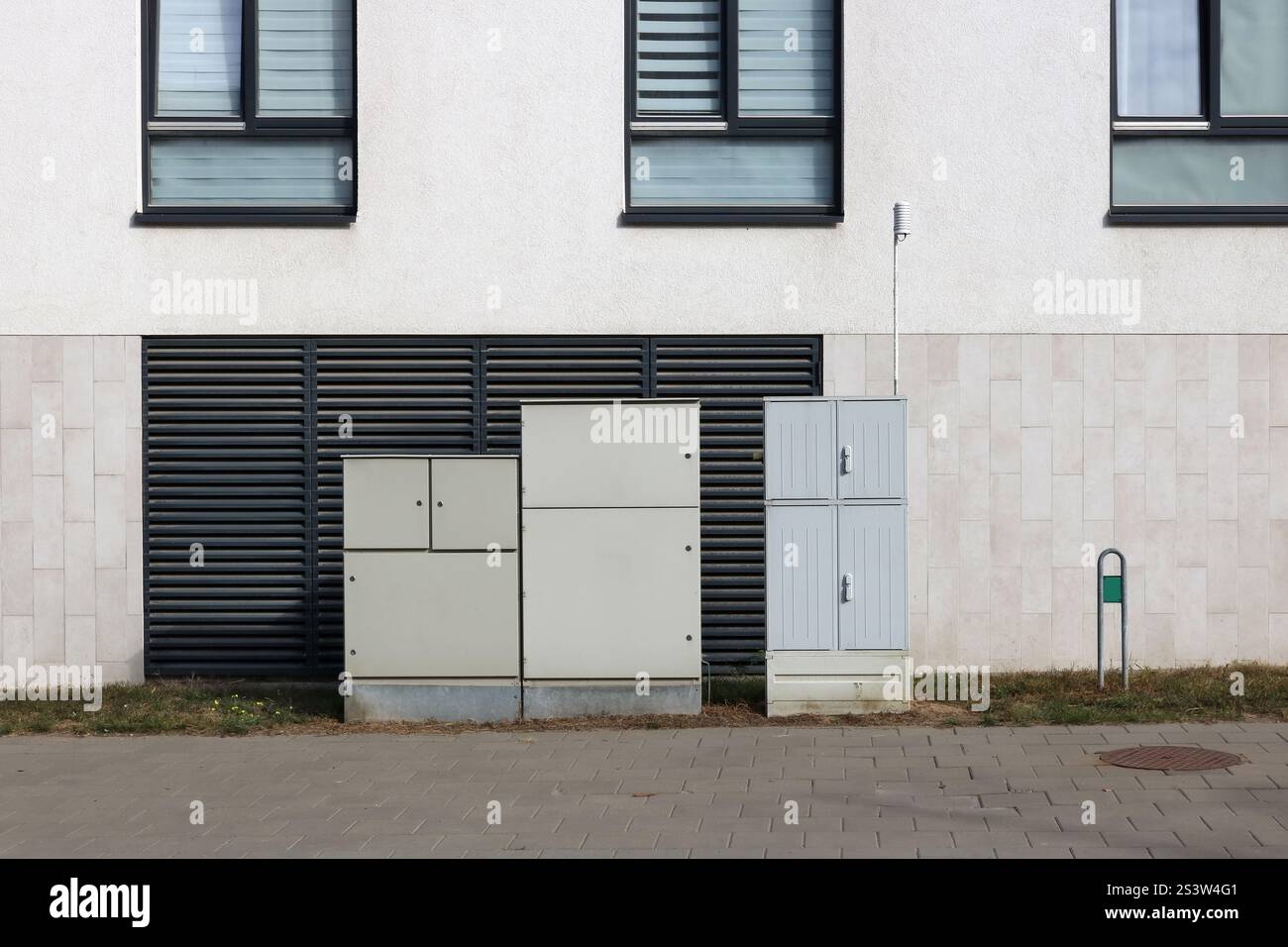 Modern power electrical distribution boxes near a residential building ...