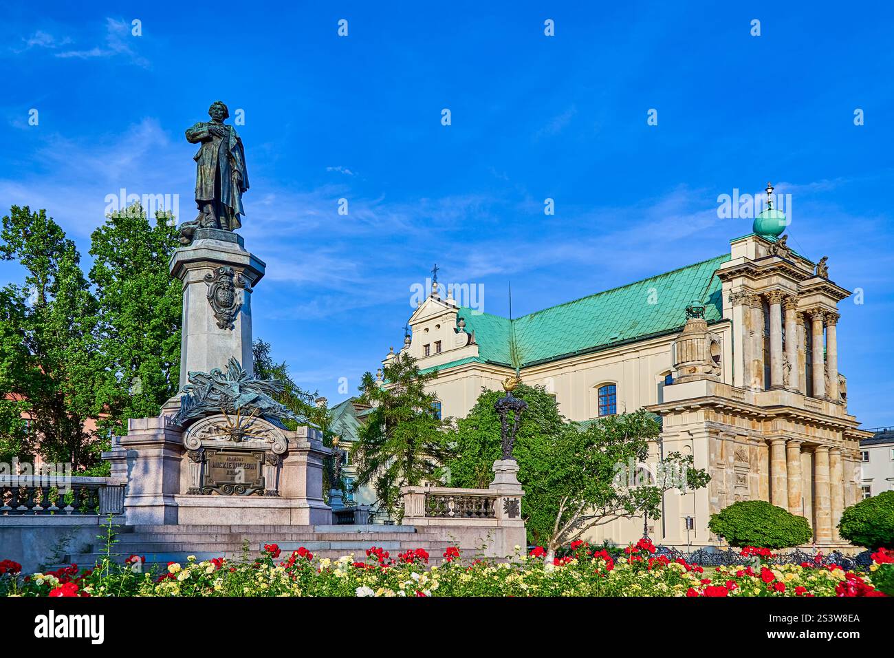 Monument to Adam Mickiewicz in the Adam Mickiewicz Square with colorful ...