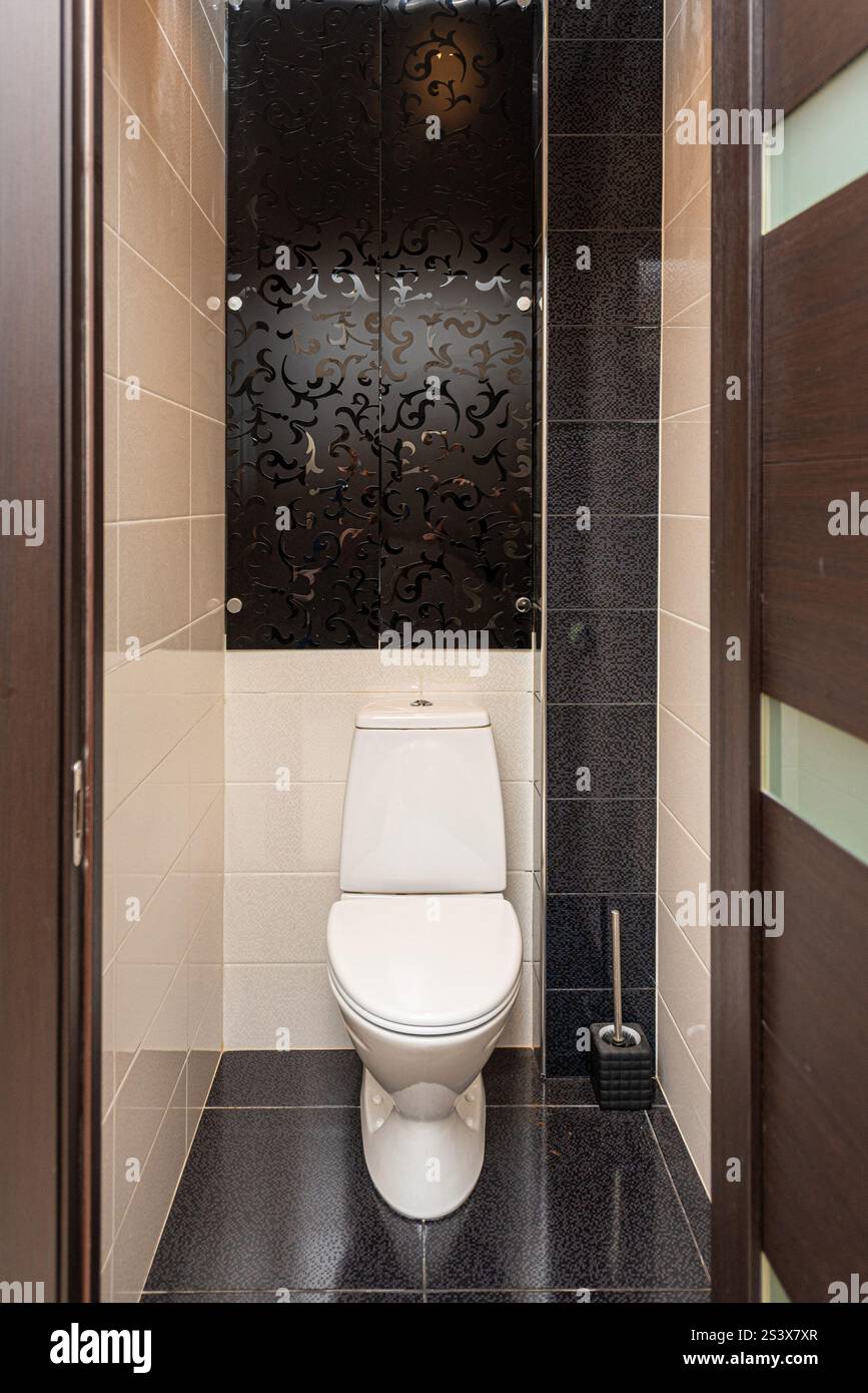 Simple bathroom interior in a residential building, toilet design in a ...