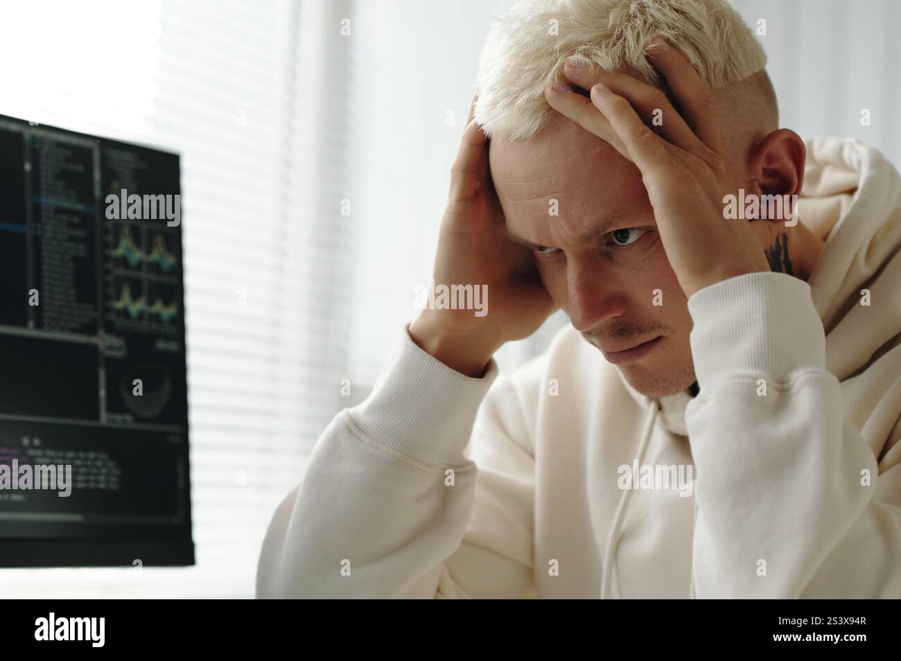 Programmer having problem with computer system while sitting at his ...