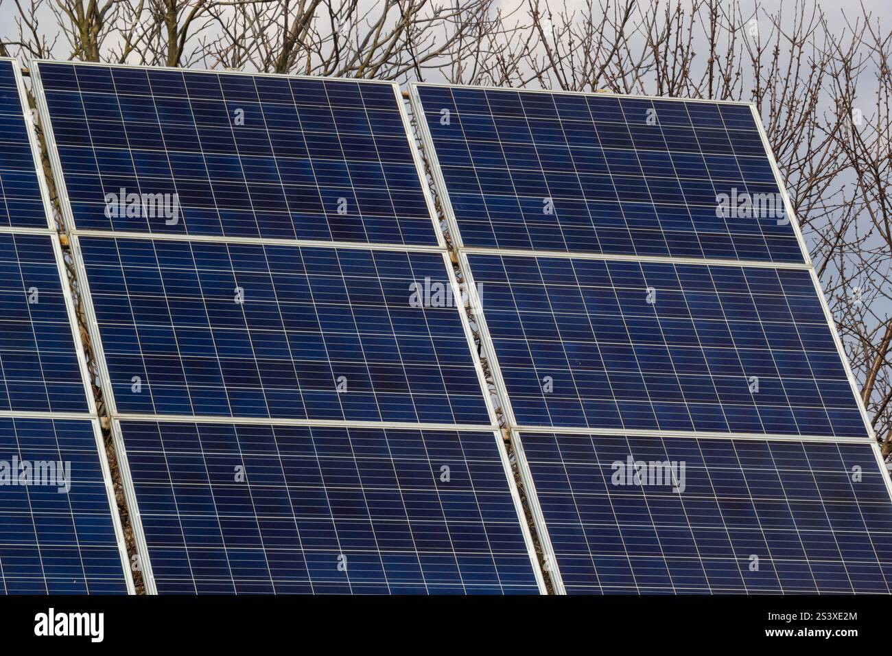 Solar panels are positioned to absorb sunlight despite the overcast sky ...