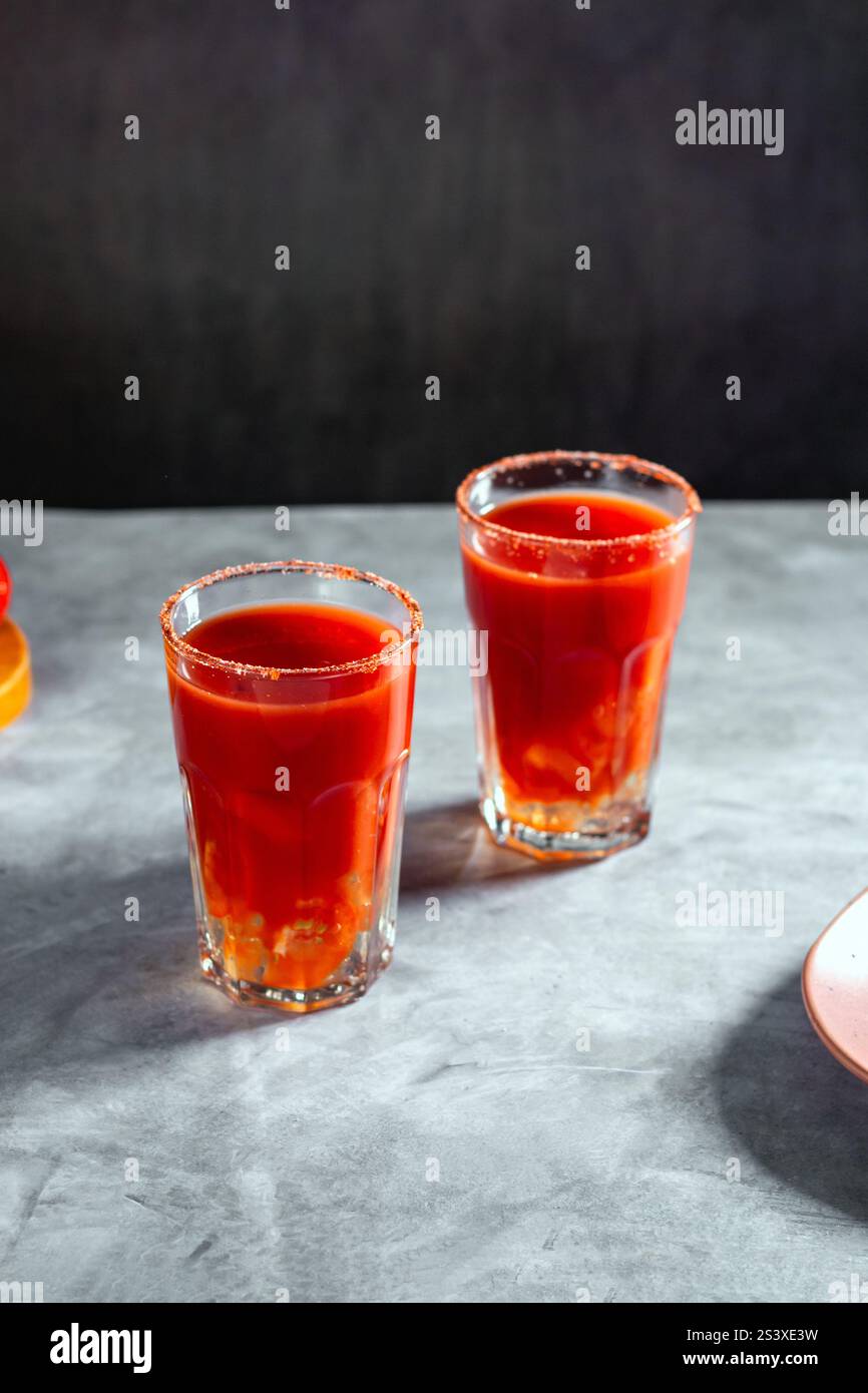 Two refreshing vegetable cocktails. Red cocktail. Tomato juice served ...
