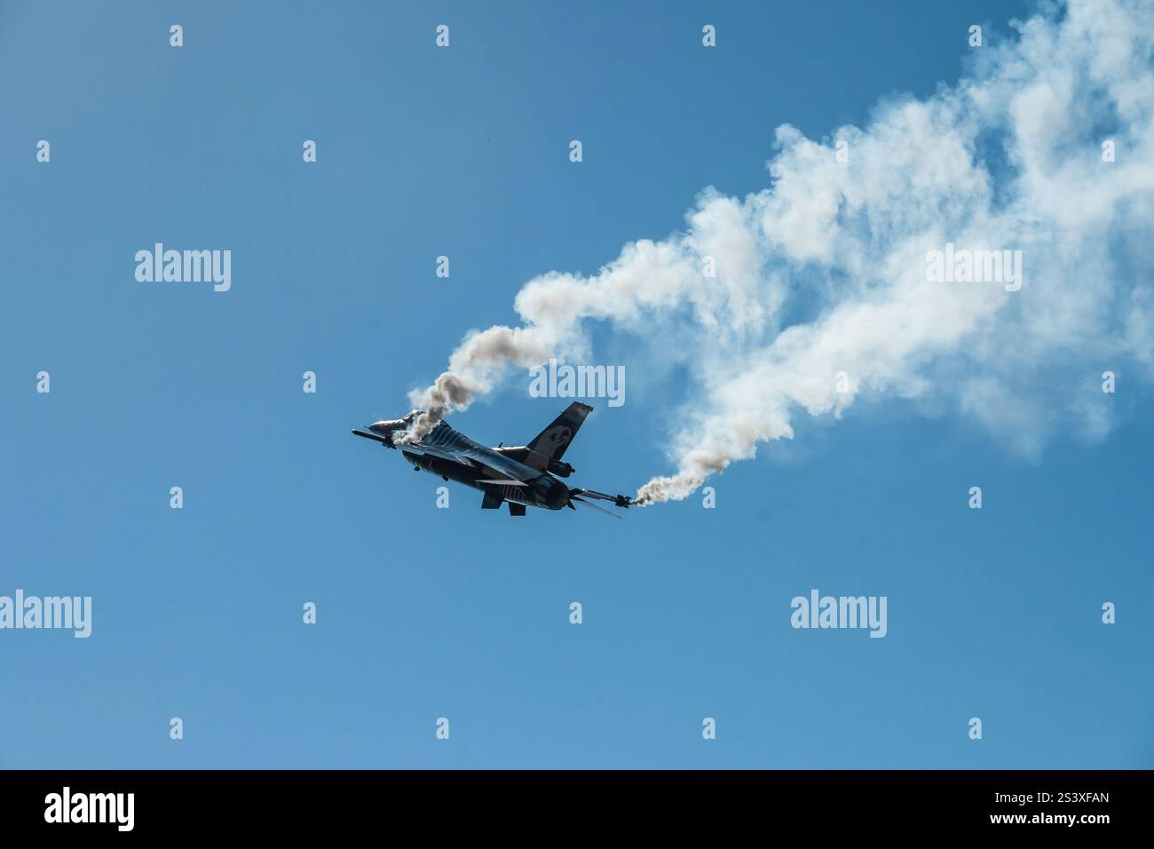 air show, showcasing a Turkish Air Force F-16 fighter jet performing a ...