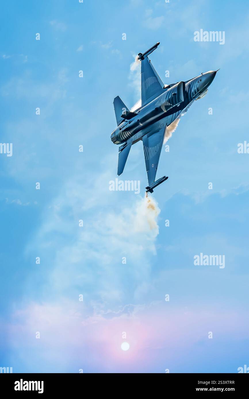 Fighter Jet with smoke trails streaming from its engines Stock Photo ...