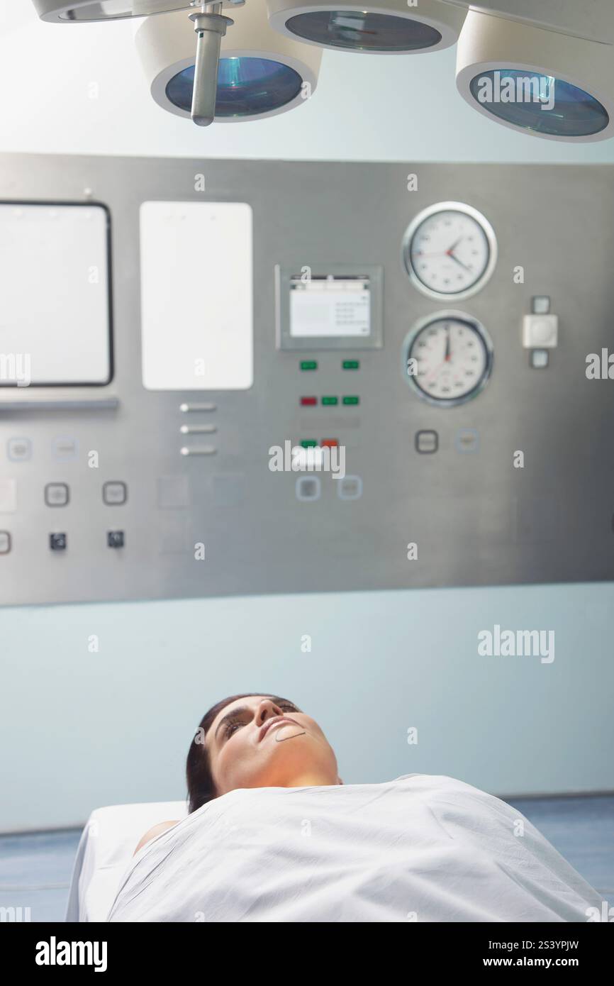 Woman lying on operating table hi-res stock photography and images - Alamy